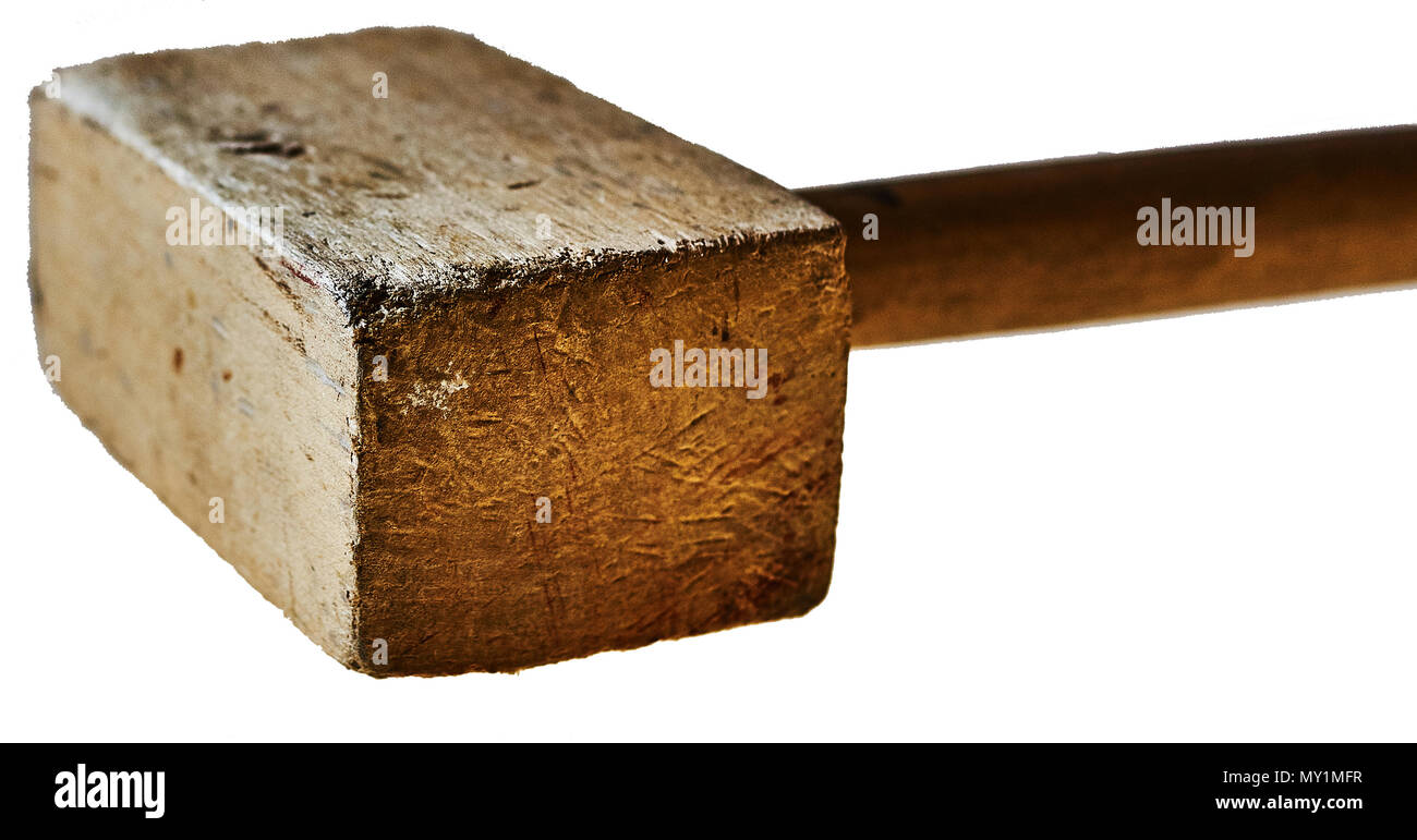 A hammer from a tree lies on an isolated background. The hammer was ...