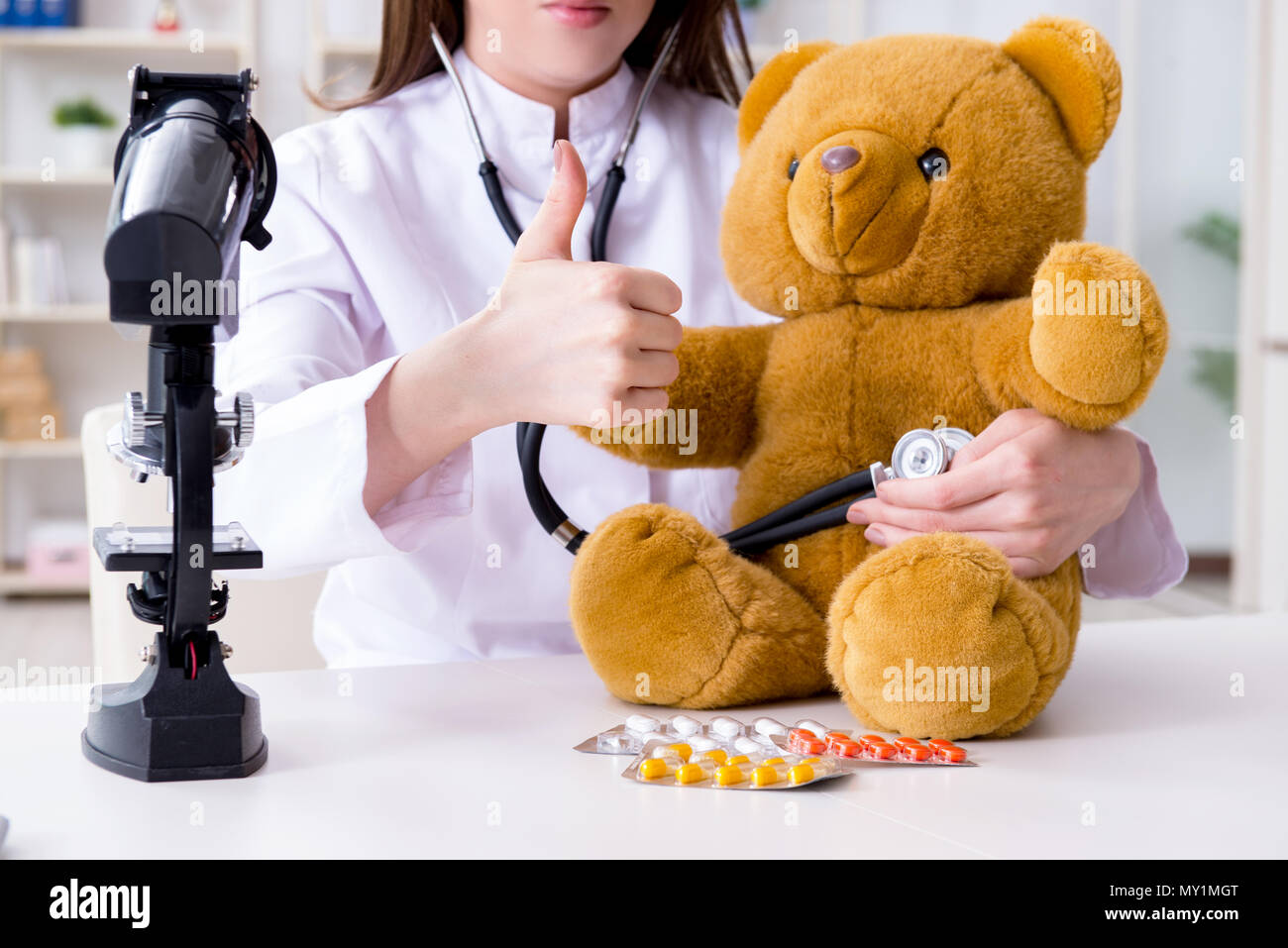 Child checking soft toy health Stock Photo - Alamy