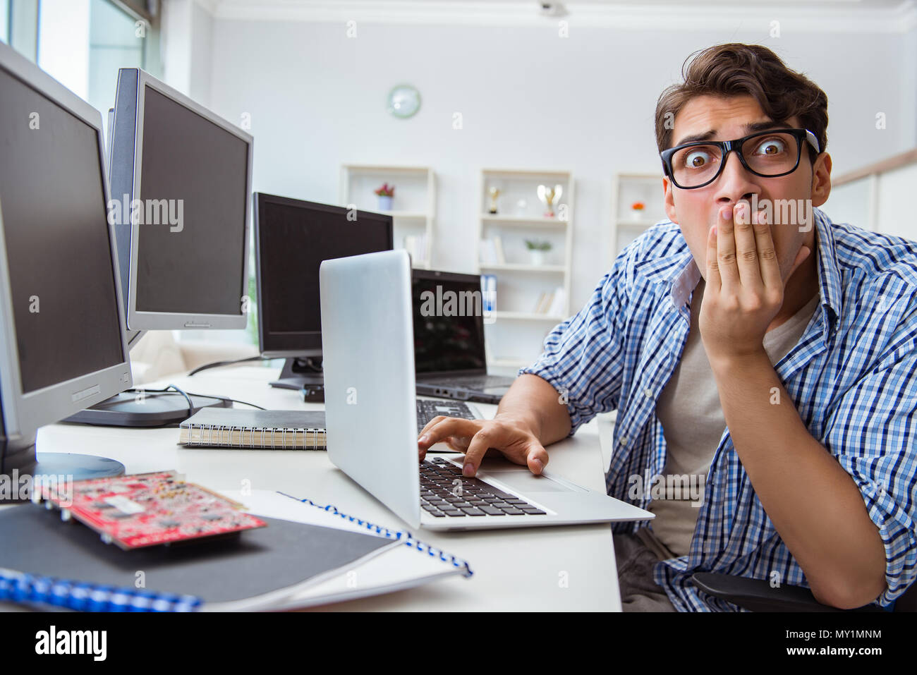 Man in front of many screens hi-res stock photography and images - Alamy