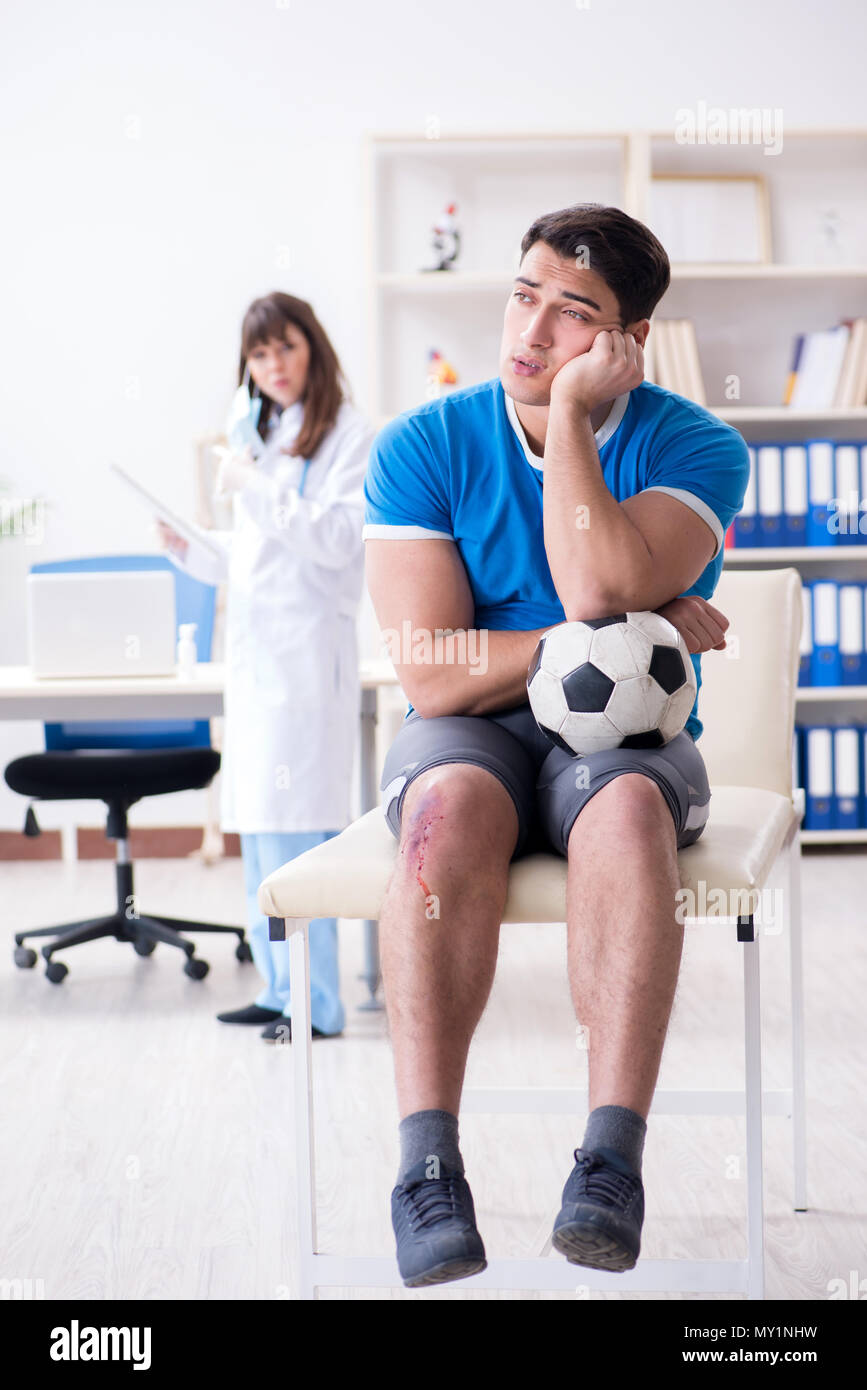 Football soccer player visiting doctor after injury Stock Photo - Alamy