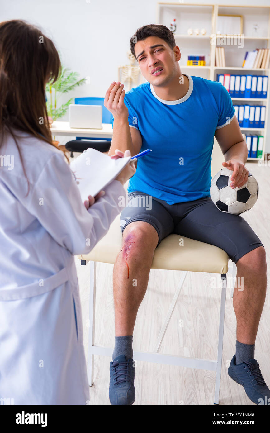 Football soccer player visiting doctor after injury Stock Photo - Alamy