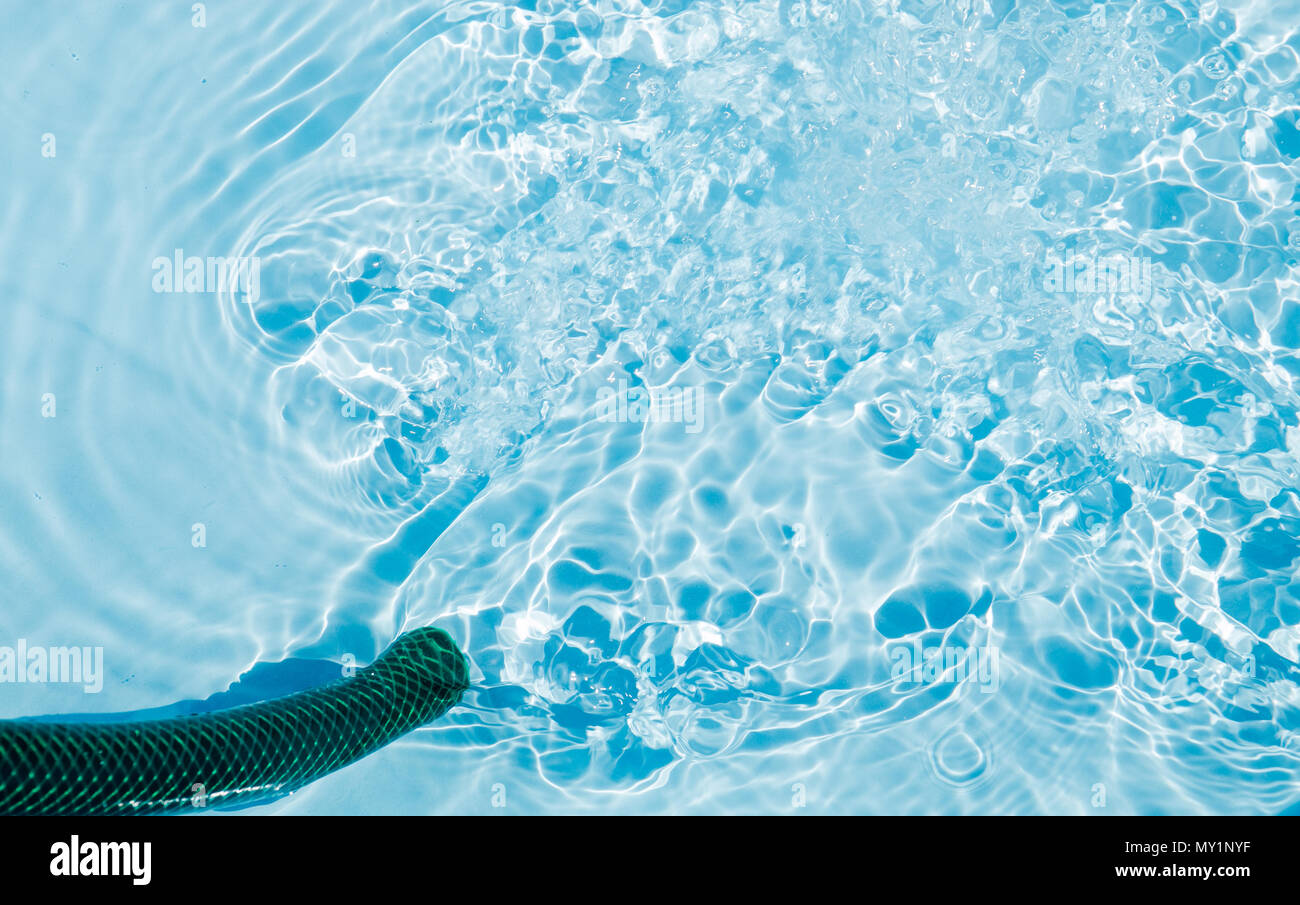 Water pool hose fills the background texture pattern Stock Photo - Alamy
