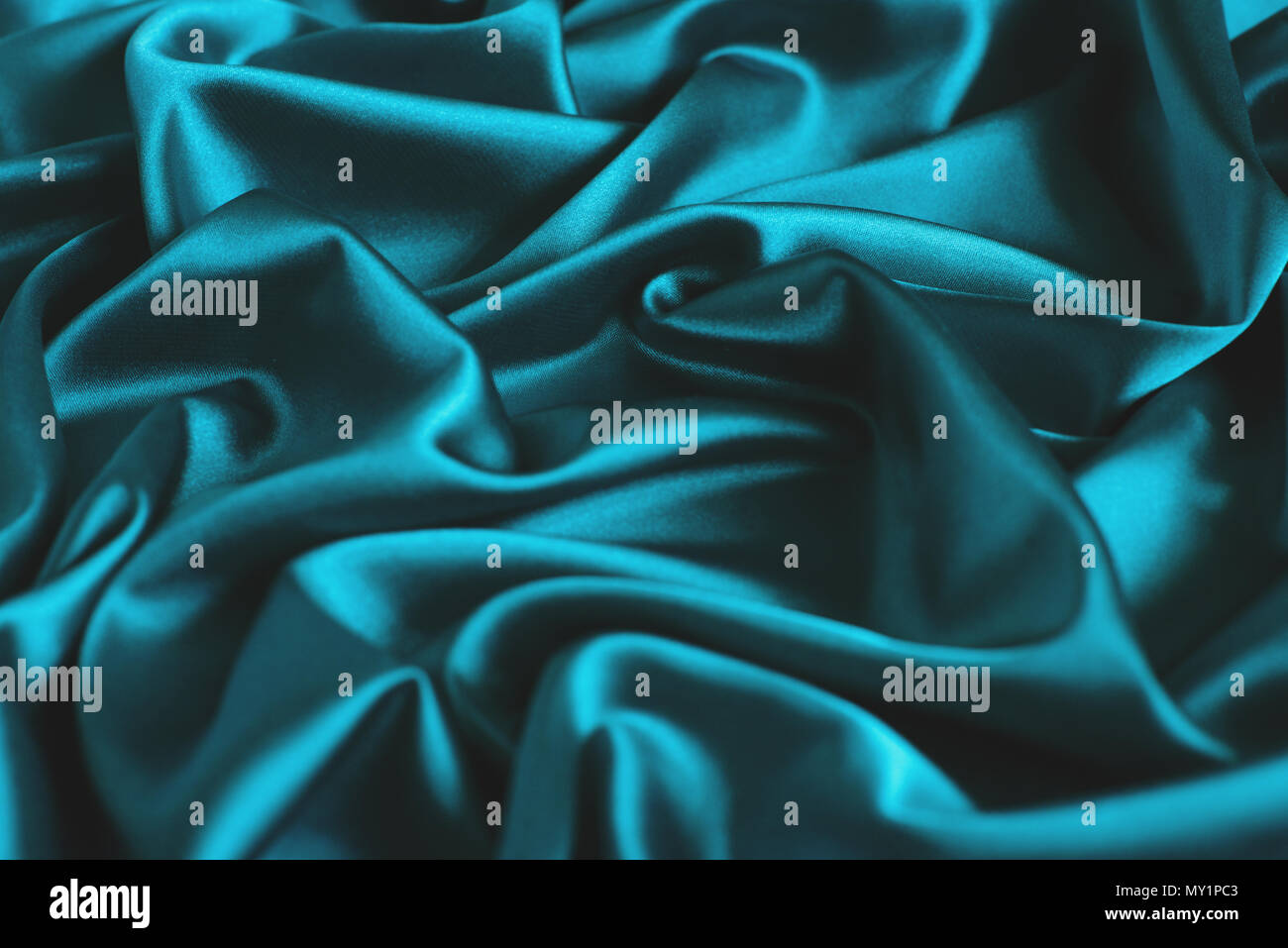 Turquoise fabric folds hi-res stock photography and images - Alamy