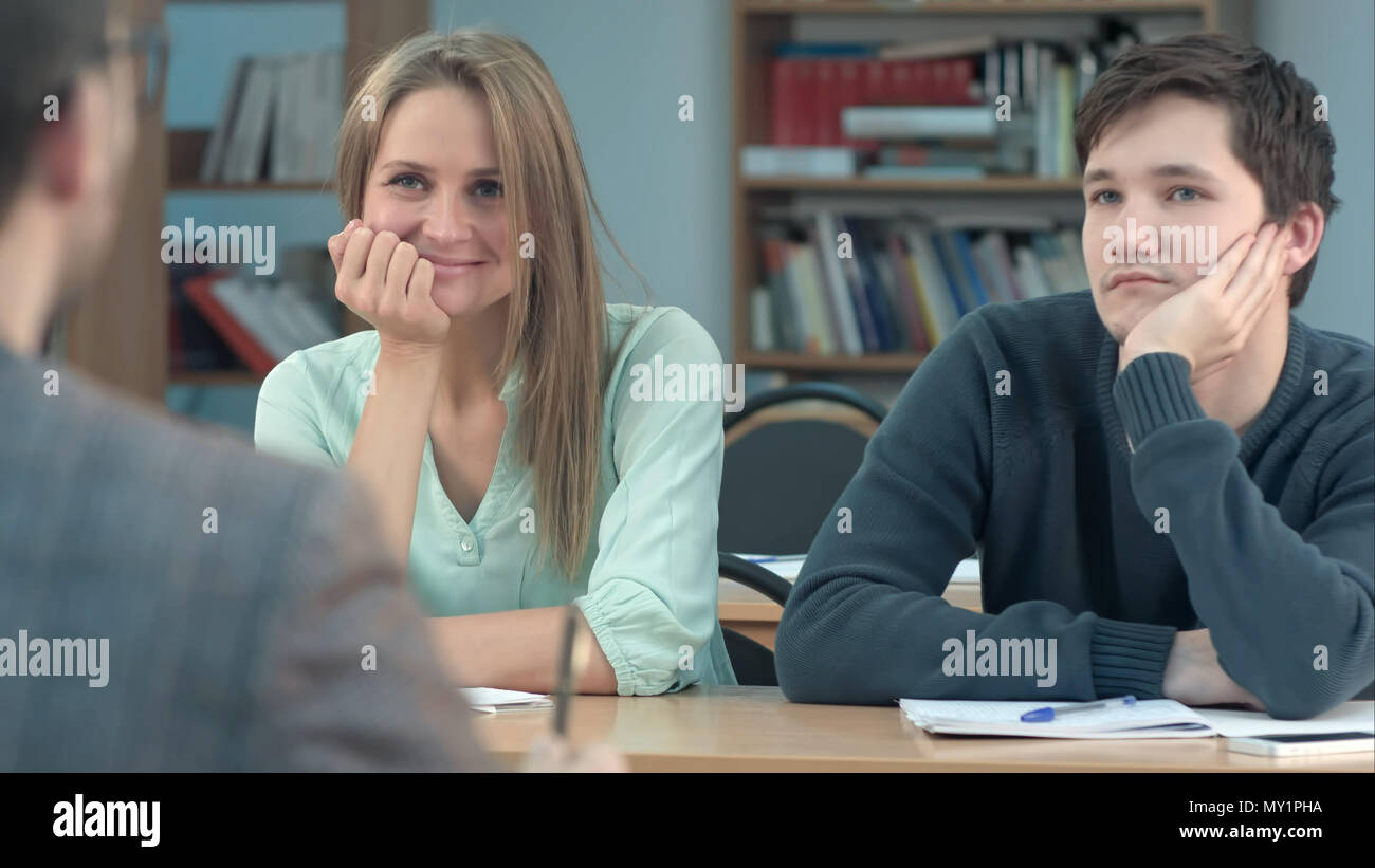 Young students during listening an interesting lecture Stock Photo - Alamy