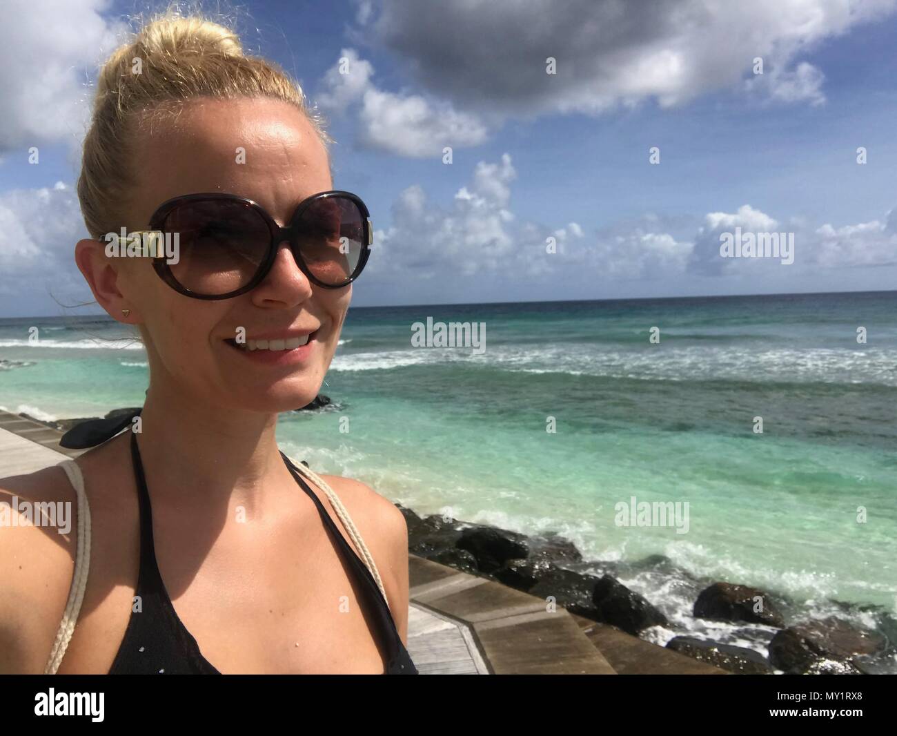 Beautiful Blonde Woman In Barbados Wearing A Bikini At A Untouched