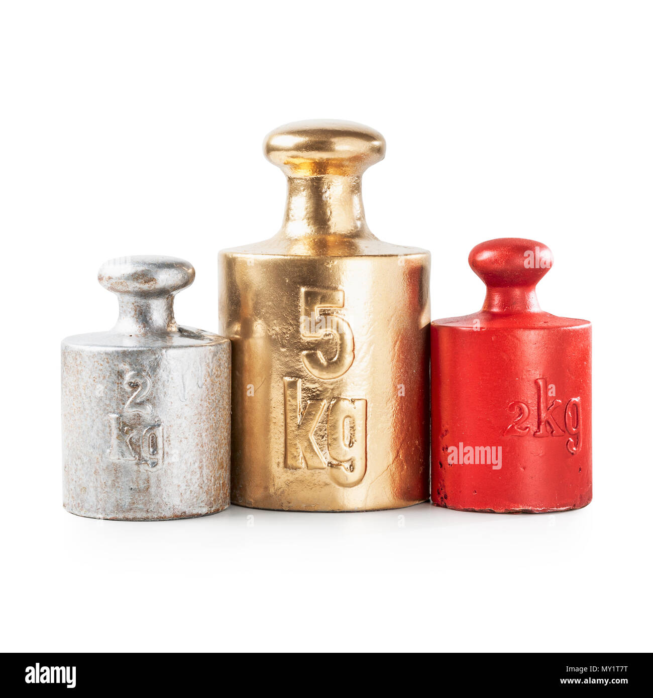 Old weights gold, silver and red colored isolated on white background ...