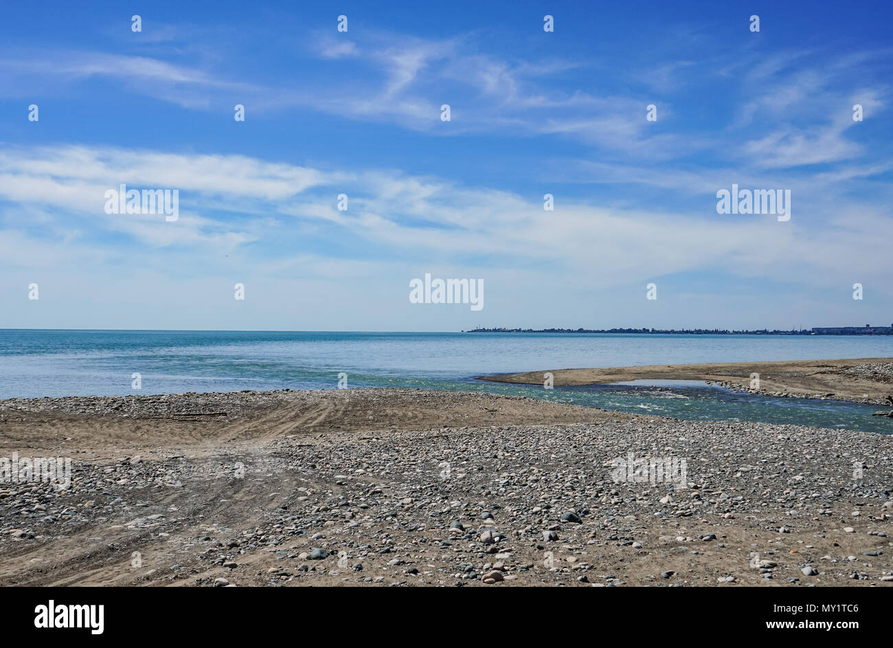 Seascape without people with a large pebble beach and blue sea to the ...
