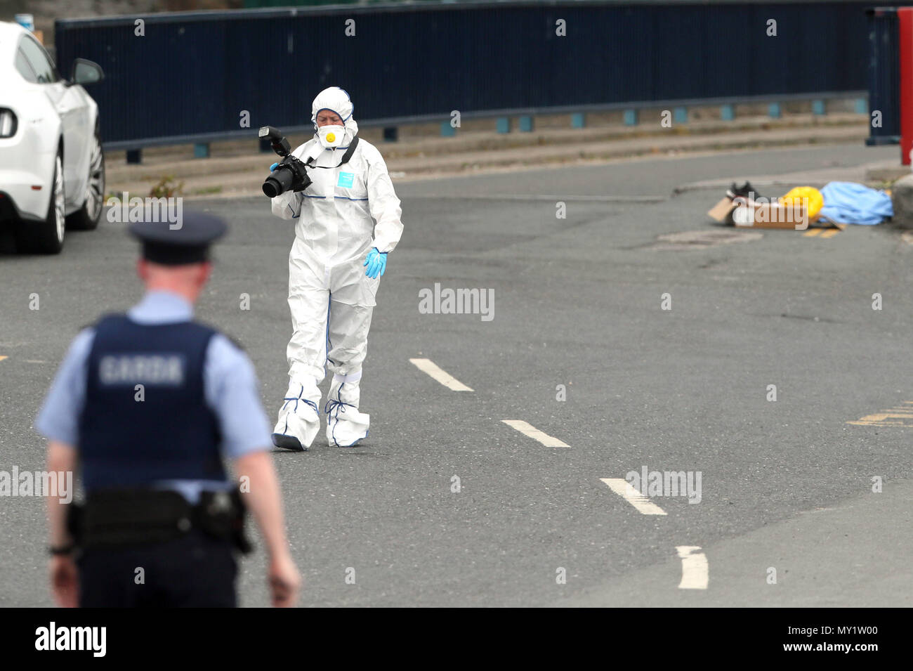 A forensic officer in Bray, Co Wicklow, where three men were shot at a ...