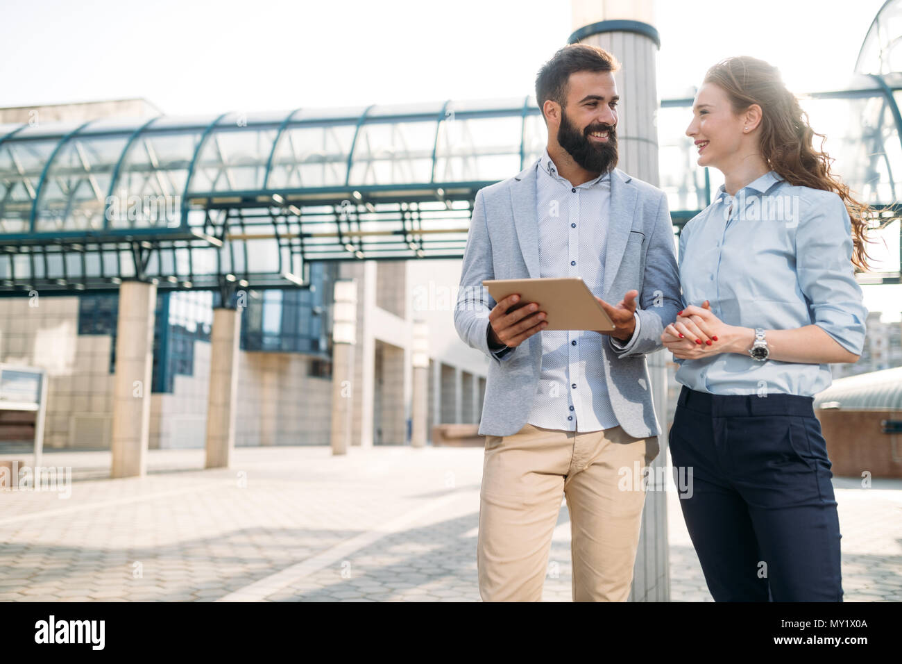 Walking street chatting male female hi-res stock photography and images ...