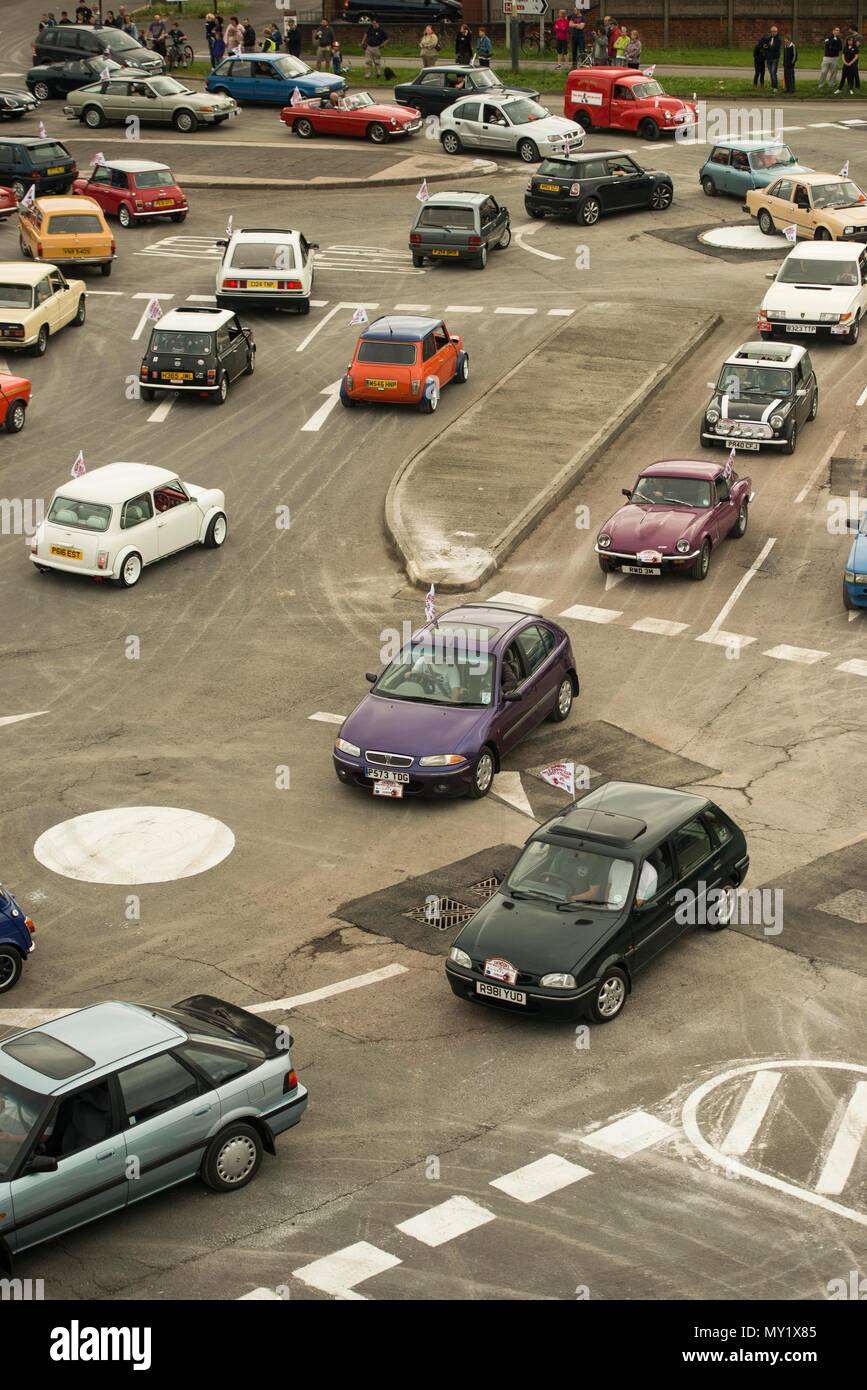 Collection of 60 classic cars parade around the Magic Roundabout ...