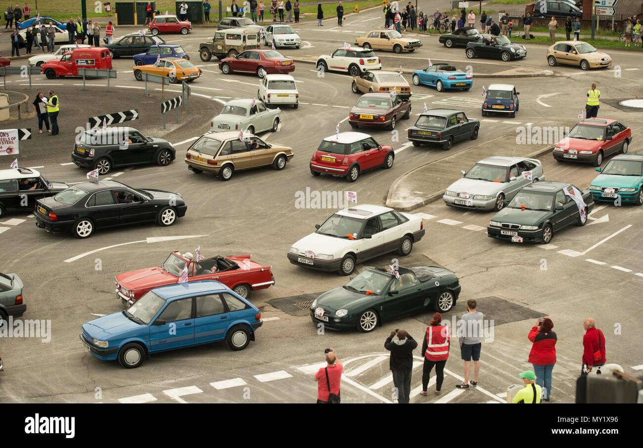 Collection of 60 classic cars parade around the Magic Roundabout ...