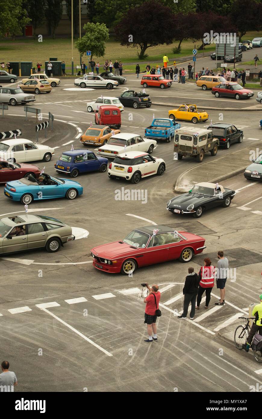 Collection of 60 classic cars parade around the Magic Roundabout ...