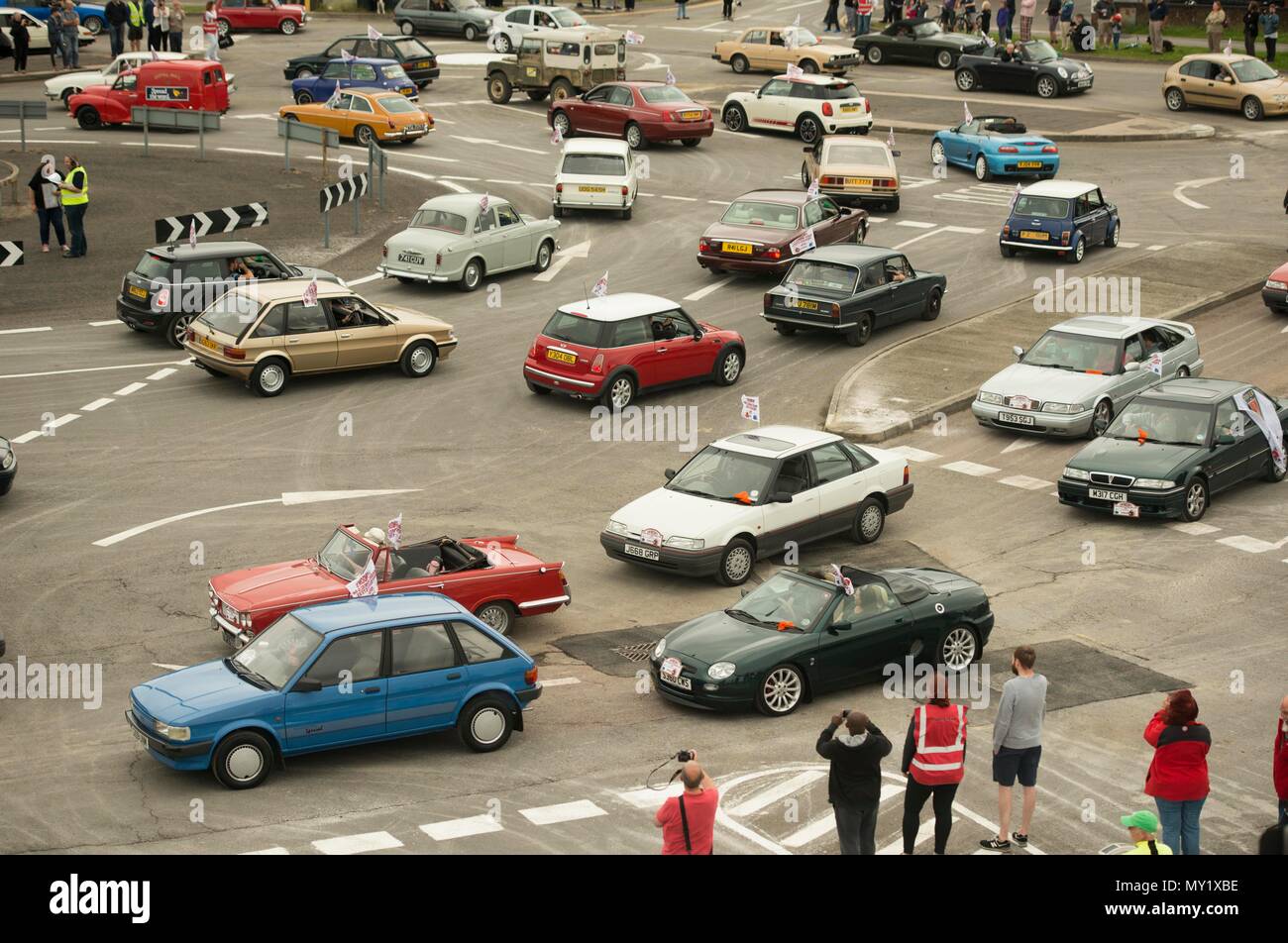 Collection of 60 classic cars parade around the Magic Roundabout ...