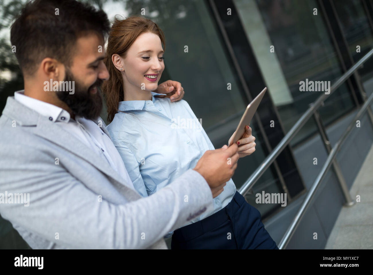Business people discussing ideas outside Stock Photo - Alamy
