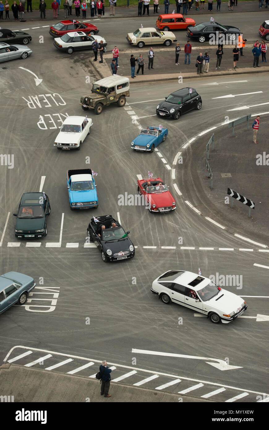 Collection of 60 classic cars parade around the Magic Roundabout ...