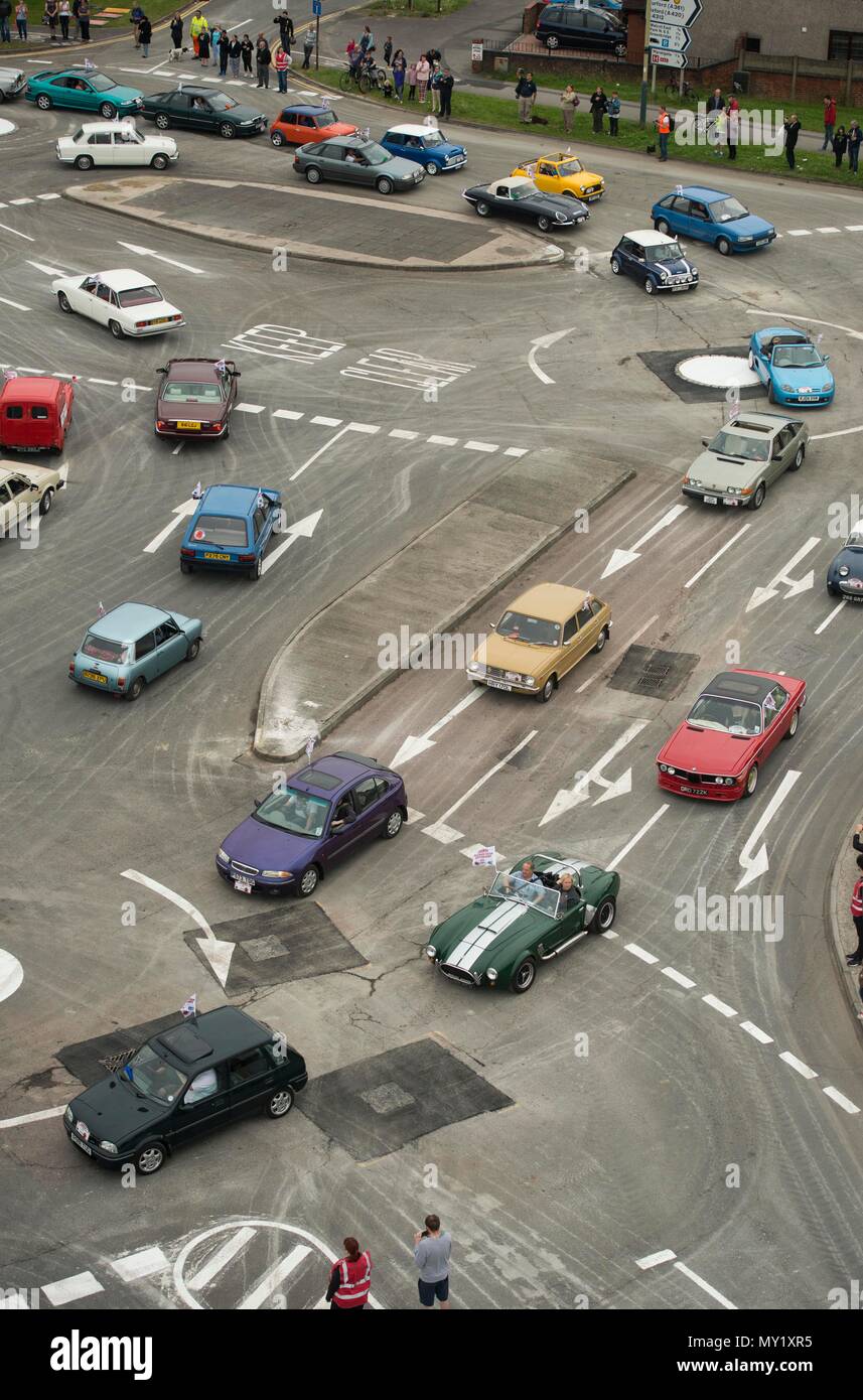 Collection of 60 classic cars parade around the Magic Roundabout ...