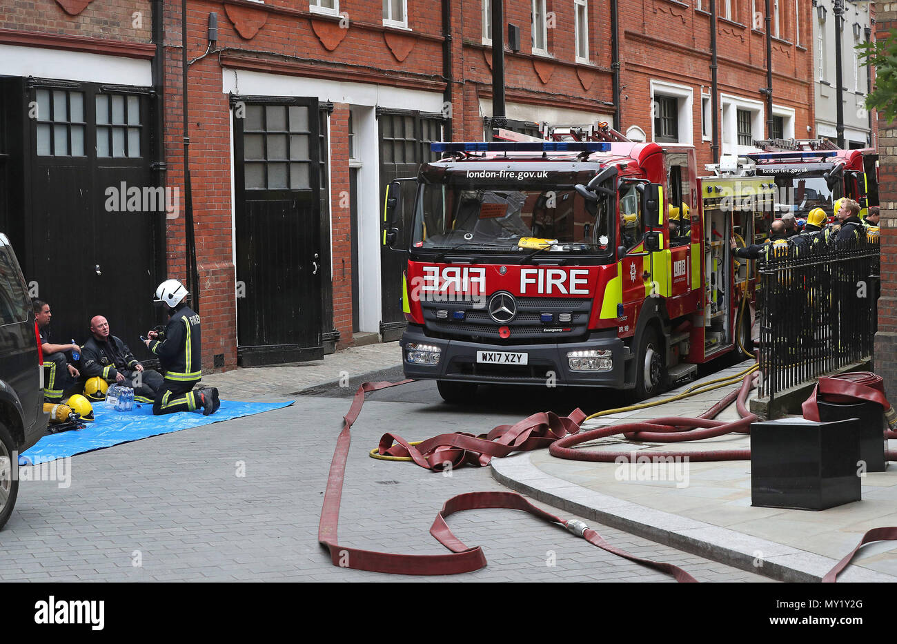 Fire fighters at the scene in Bourdon Street in Mayfair, London after a ...