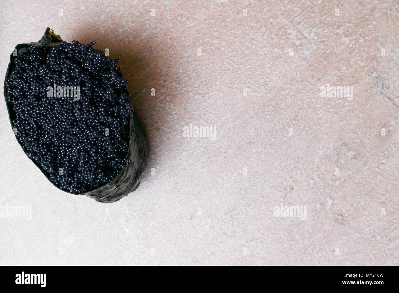 Black Tobiko flying fish roe Gunkan Maki Sushi with Cucumber. Isolated ...