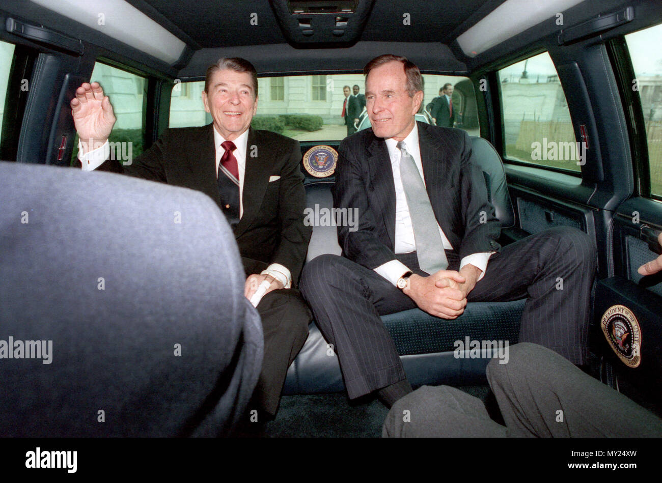 1/20/1989 President Reagan and George Bush traveling via limousine to ...