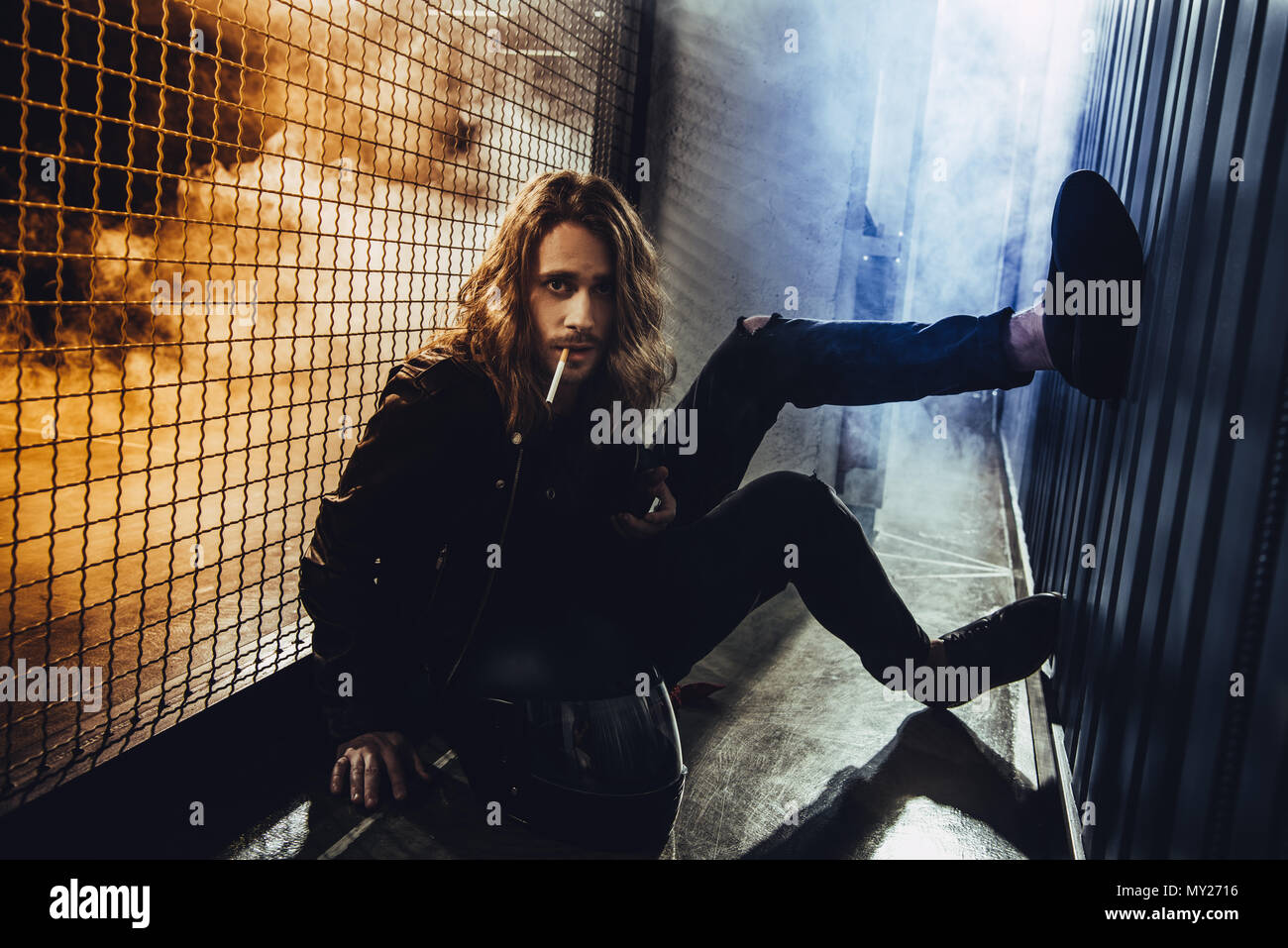 Leather jacket smoking cigarette hi-res stock photography and images ...