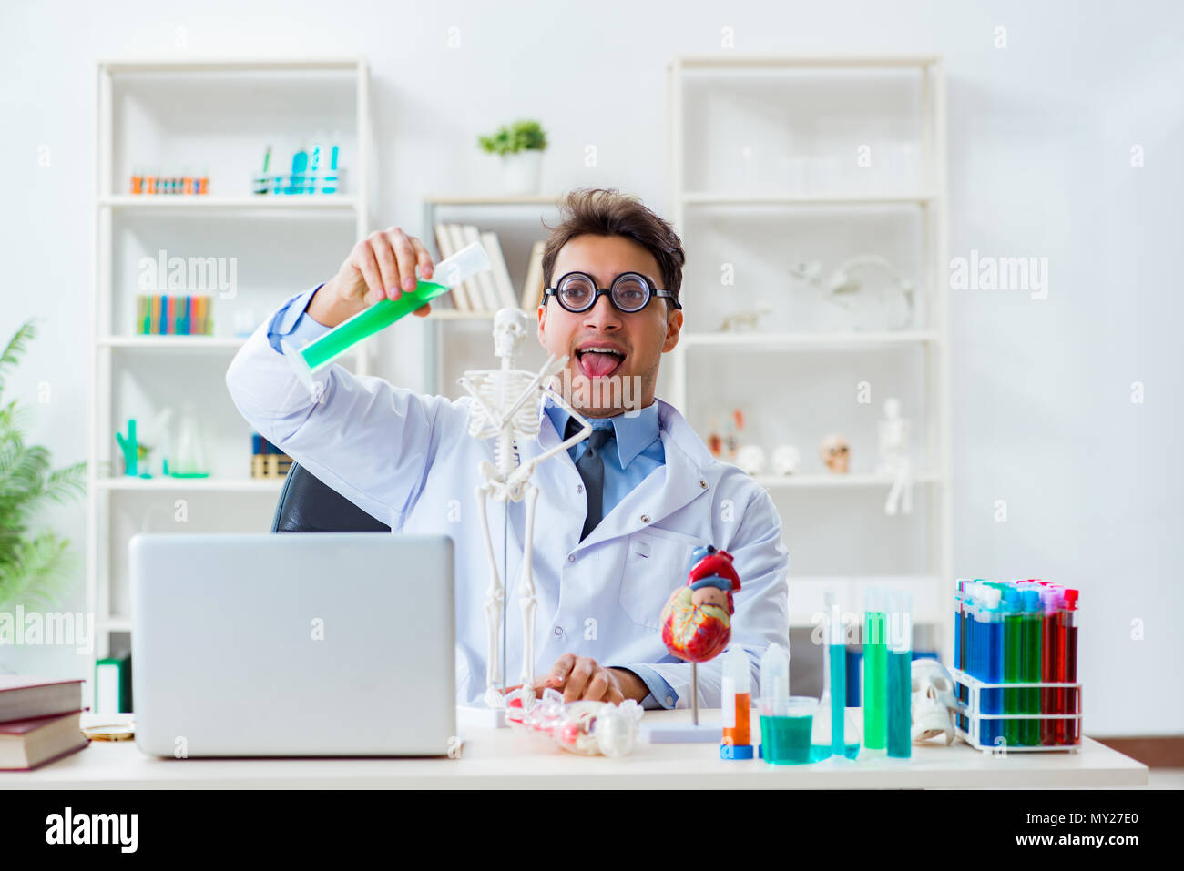 Funny doctor having fun in hospital lab Stock Photo - Alamy