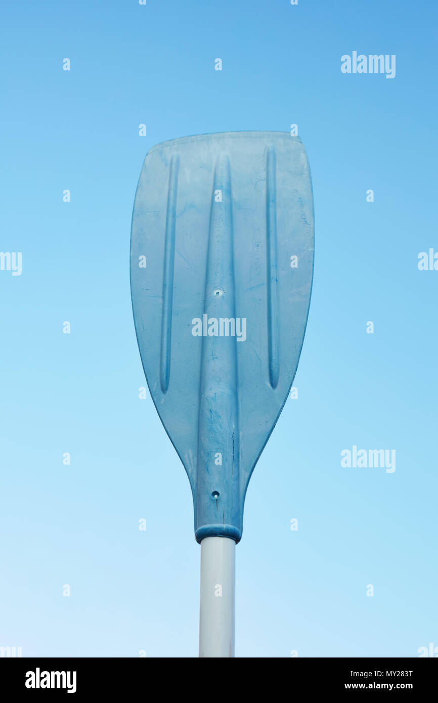 Blue oar on blue background. Concept of rowing and water sports in ...