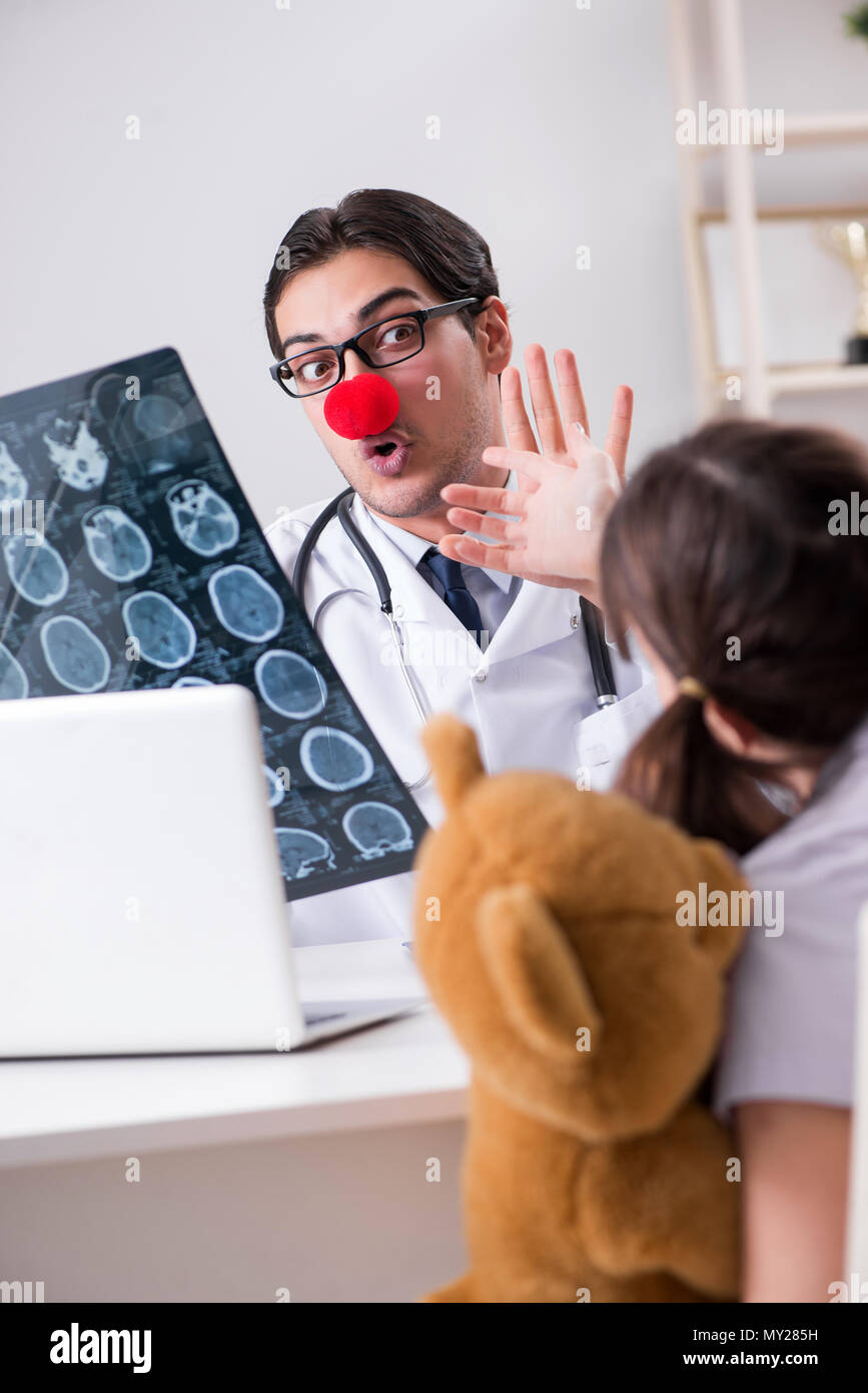 Funny pediatrician with little girl at regular check-up Stock Photo - Alamy