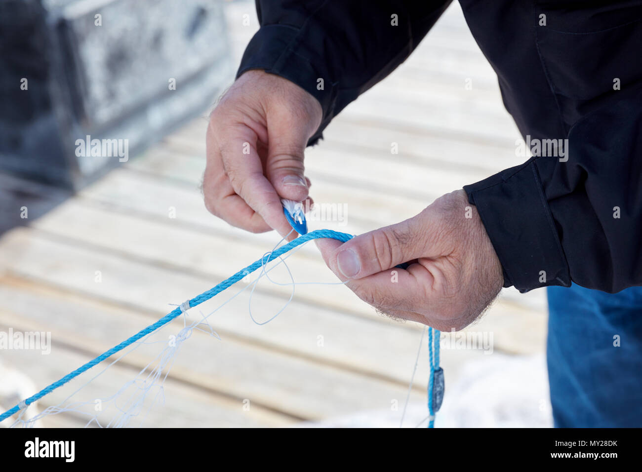 Mending fishnet fisherman hi-res stock photography and images - Alamy