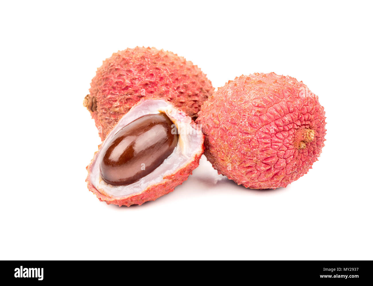Two lychee fruit in shell half on white background Stock Photo - Alamy