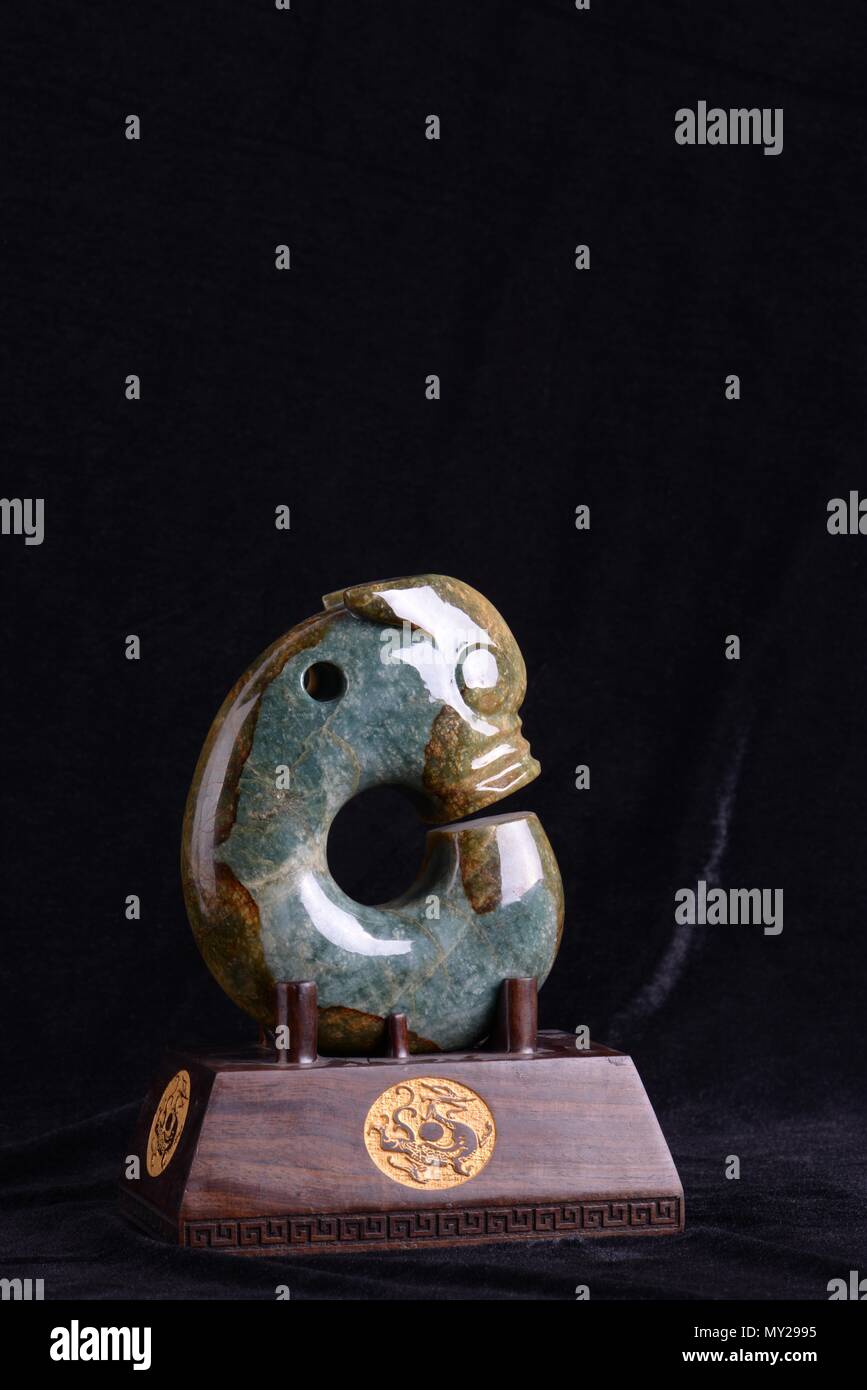 Chinese ancient jade carving art on a black background Stock Photo - Alamy
