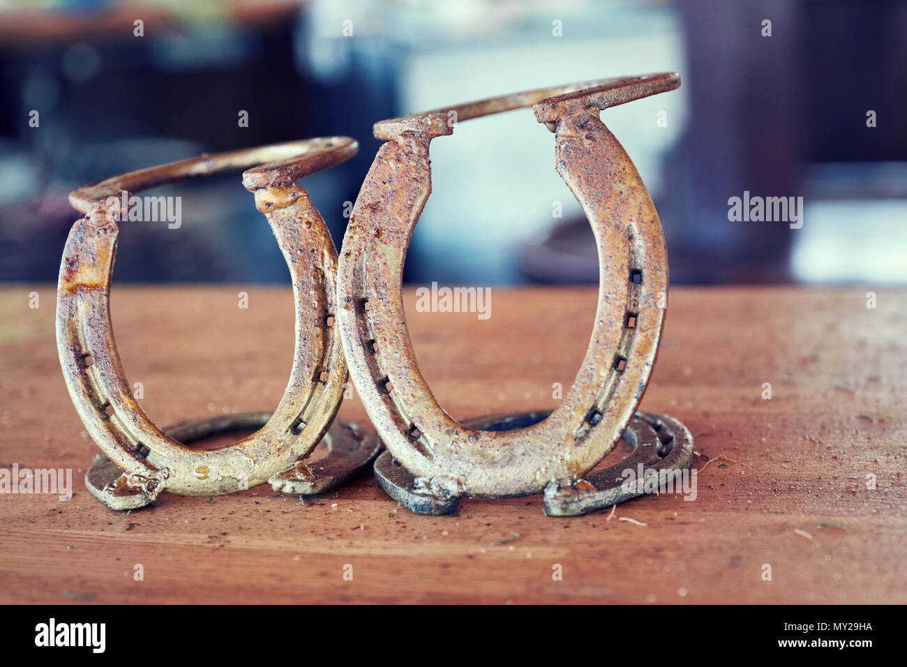 Two horseshoe decoratively used as the symbol of luck on a wooden ...