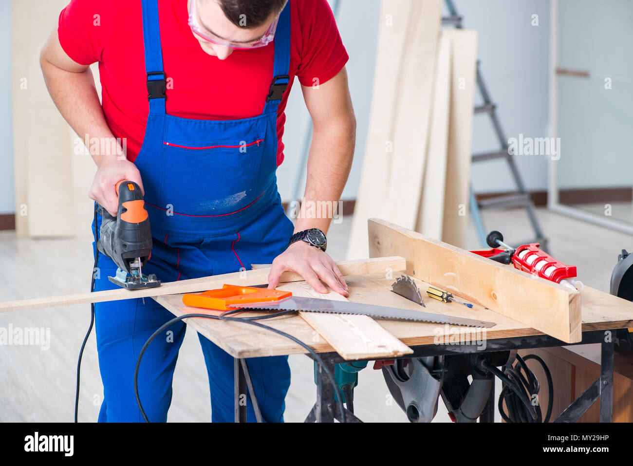 Contractor working in the workshop Stock Photo - Alamy