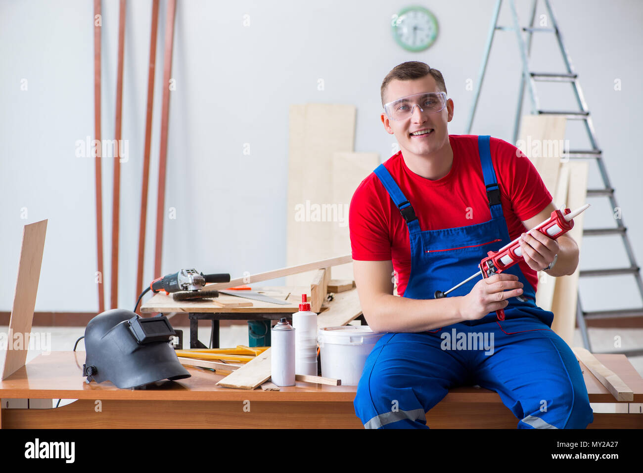 Contractor working in the workshop Stock Photo - Alamy