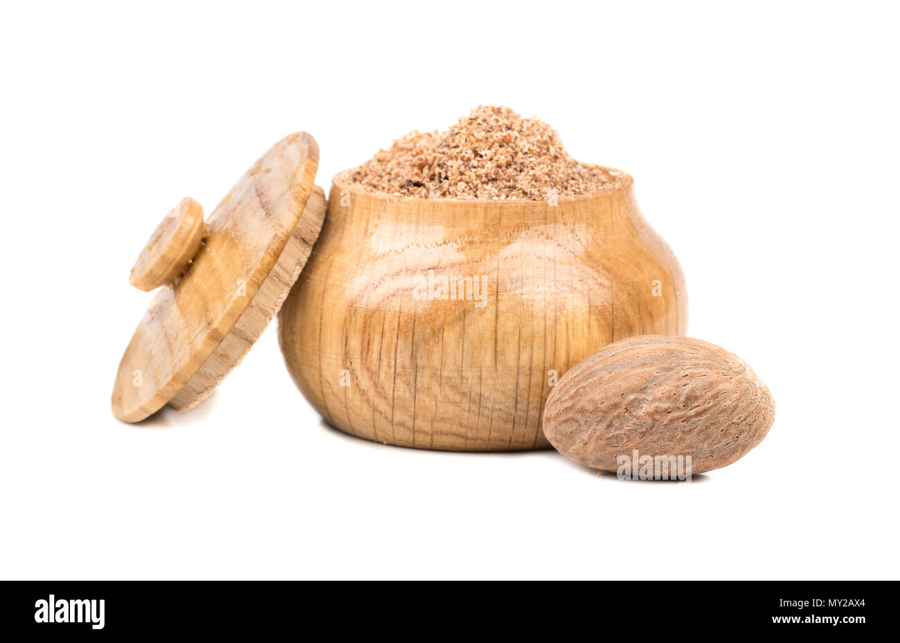 Nutmeg in a wooden jar for spice isolated on a white background Stock ...