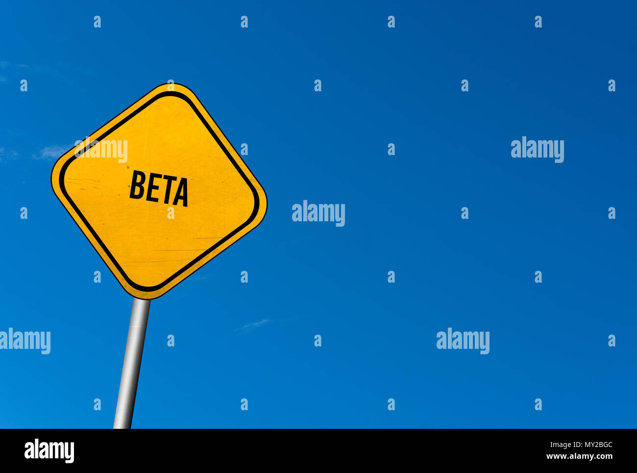 Beta - yellow sign with blue sky Stock Photo - Alamy