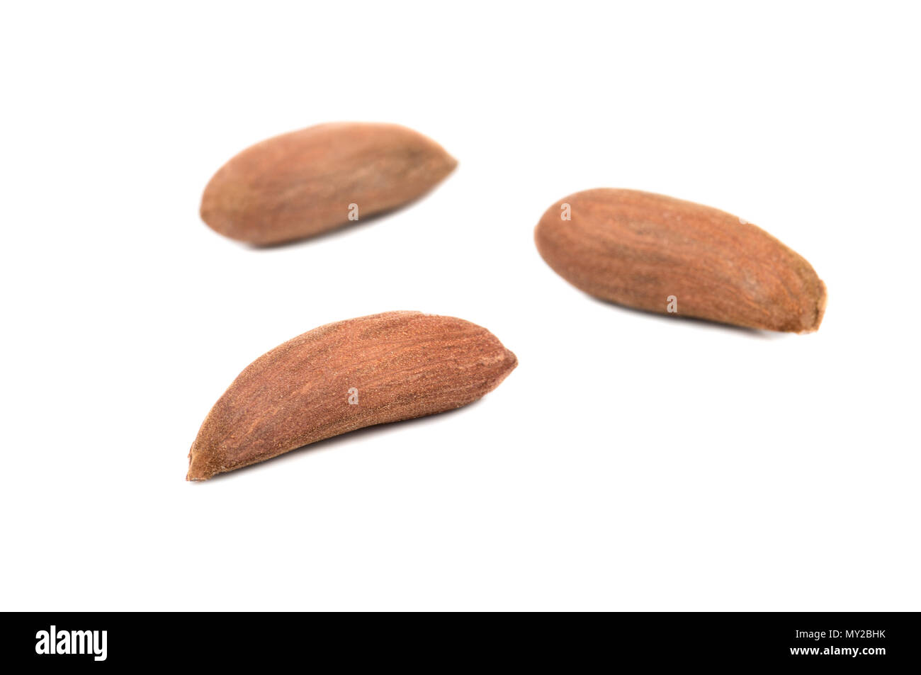 Three uzbek almonds without shell on white background Stock Photo - Alamy