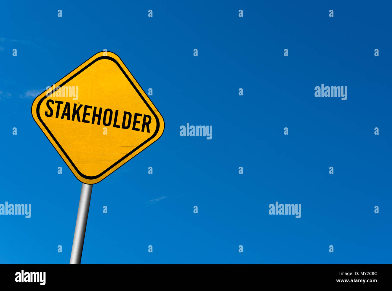 Stakeholder - yellow sign with blue sky Stock Photo - Alamy