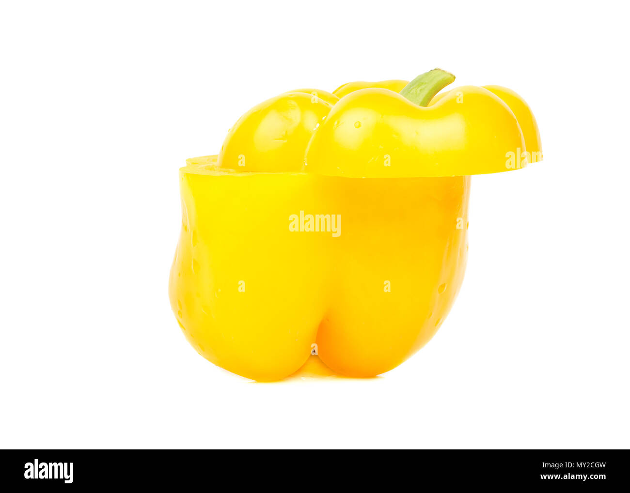 Delicious yellow pepper cut in half on white background Stock Photo - Alamy