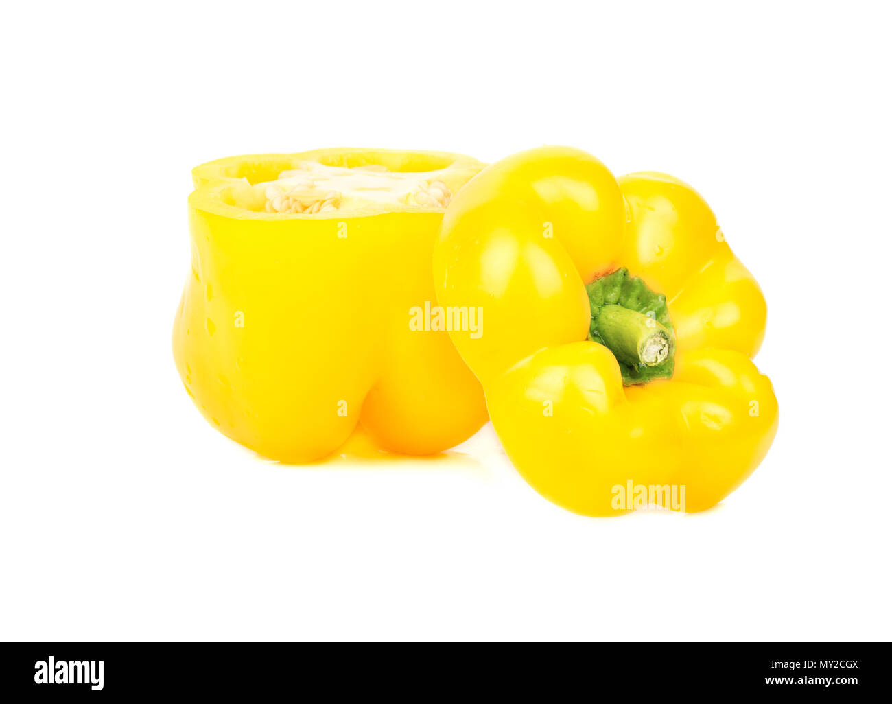 Delicious yellow pepper cut in half on white background Stock Photo - Alamy
