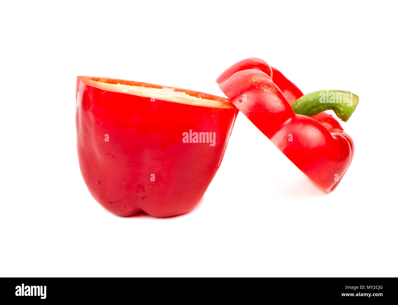 Cut in half fresh red pepper on white background Stock Photo - Alamy