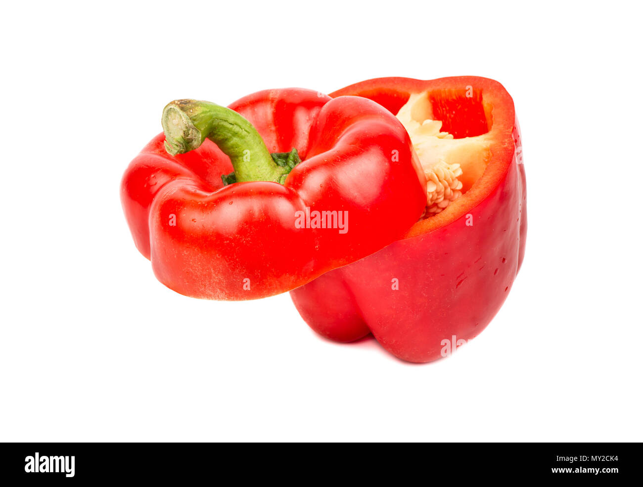 Cut in half fresh red pepper on white background Stock Photo - Alamy