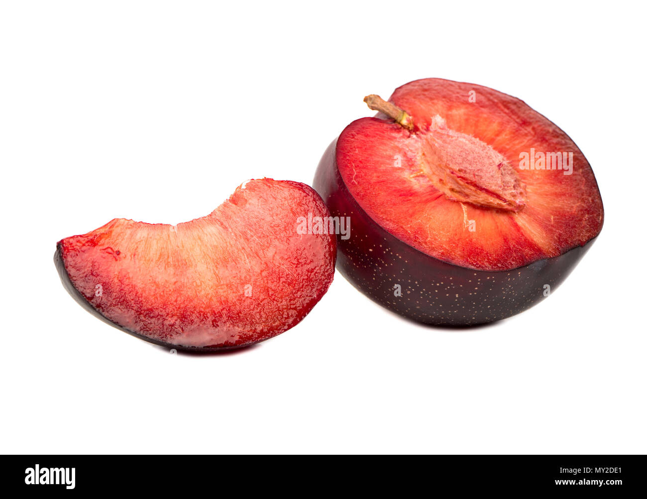 Half of a juicy red plum with slice on white background Stock Photo - Alamy