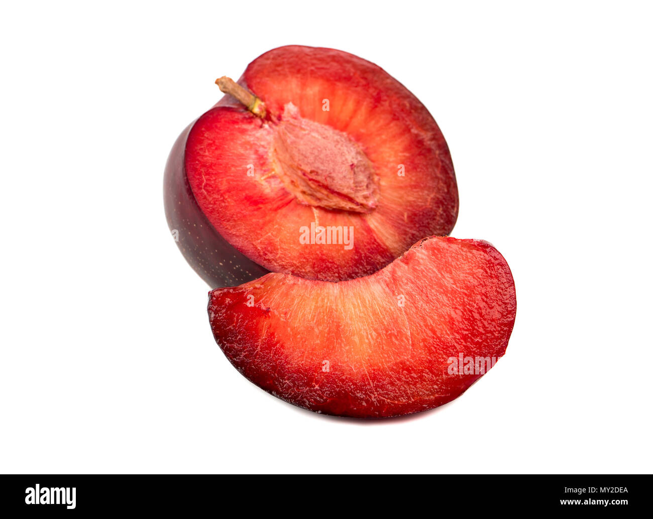Half of a juicy red plum with slice on white background Stock Photo - Alamy