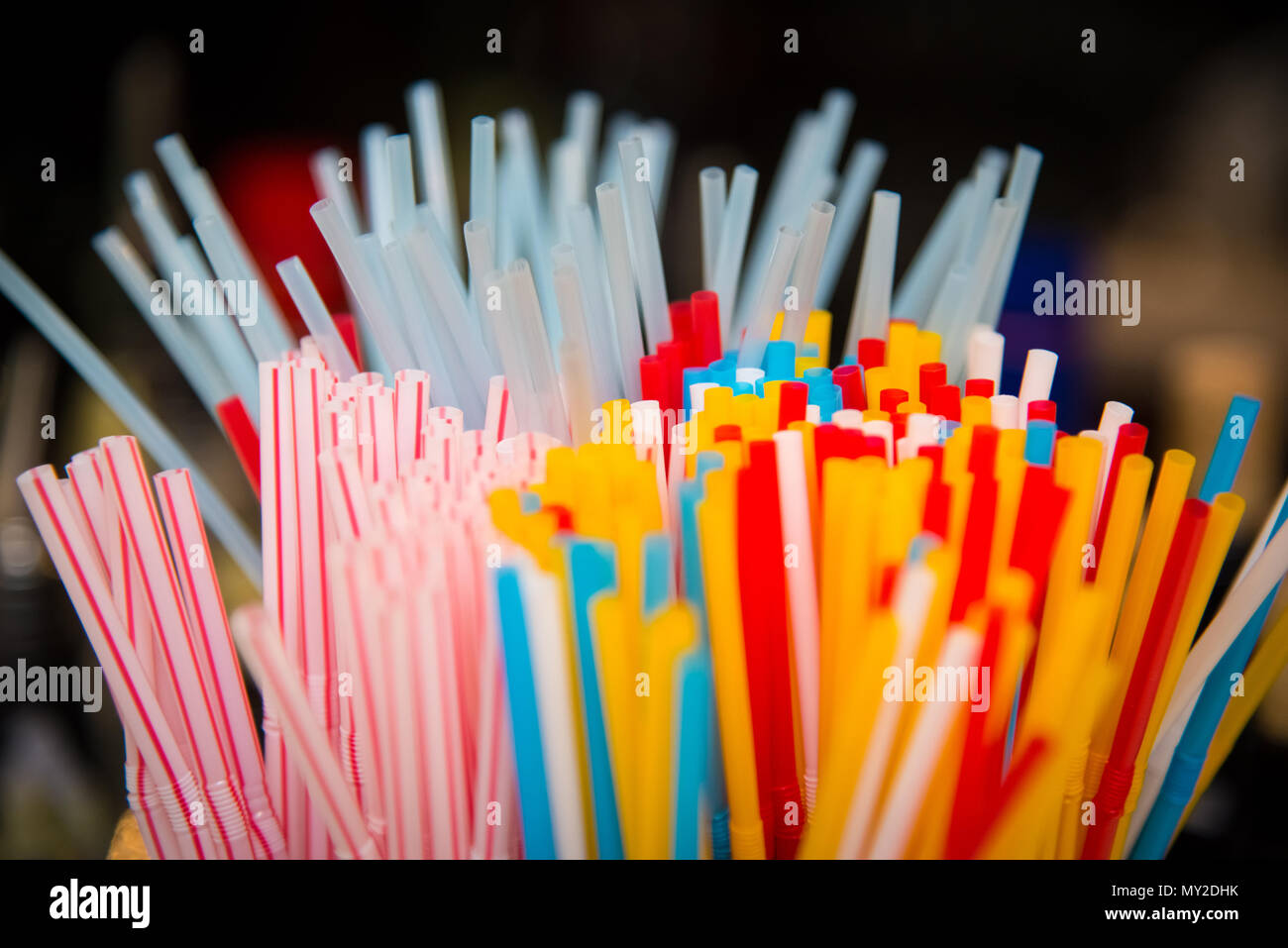 Multi-colored cocktail straws Stock Photo - Alamy
