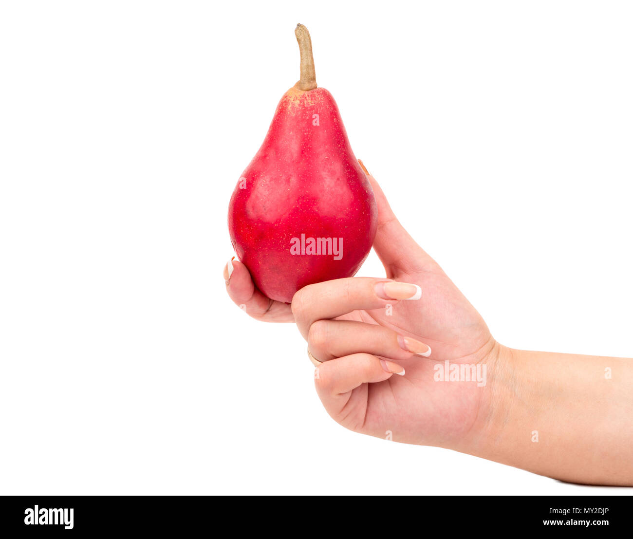 Fresh red pear in female hand on white background Stock Photo - Alamy