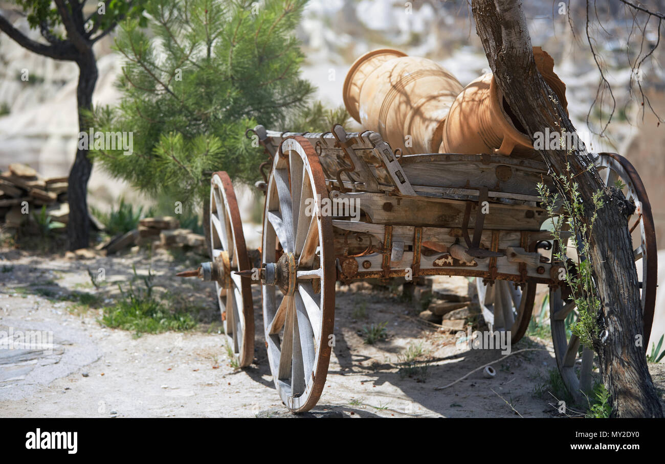 Ancient wooden wheeled wagon with pots Stock Photo - Alamy