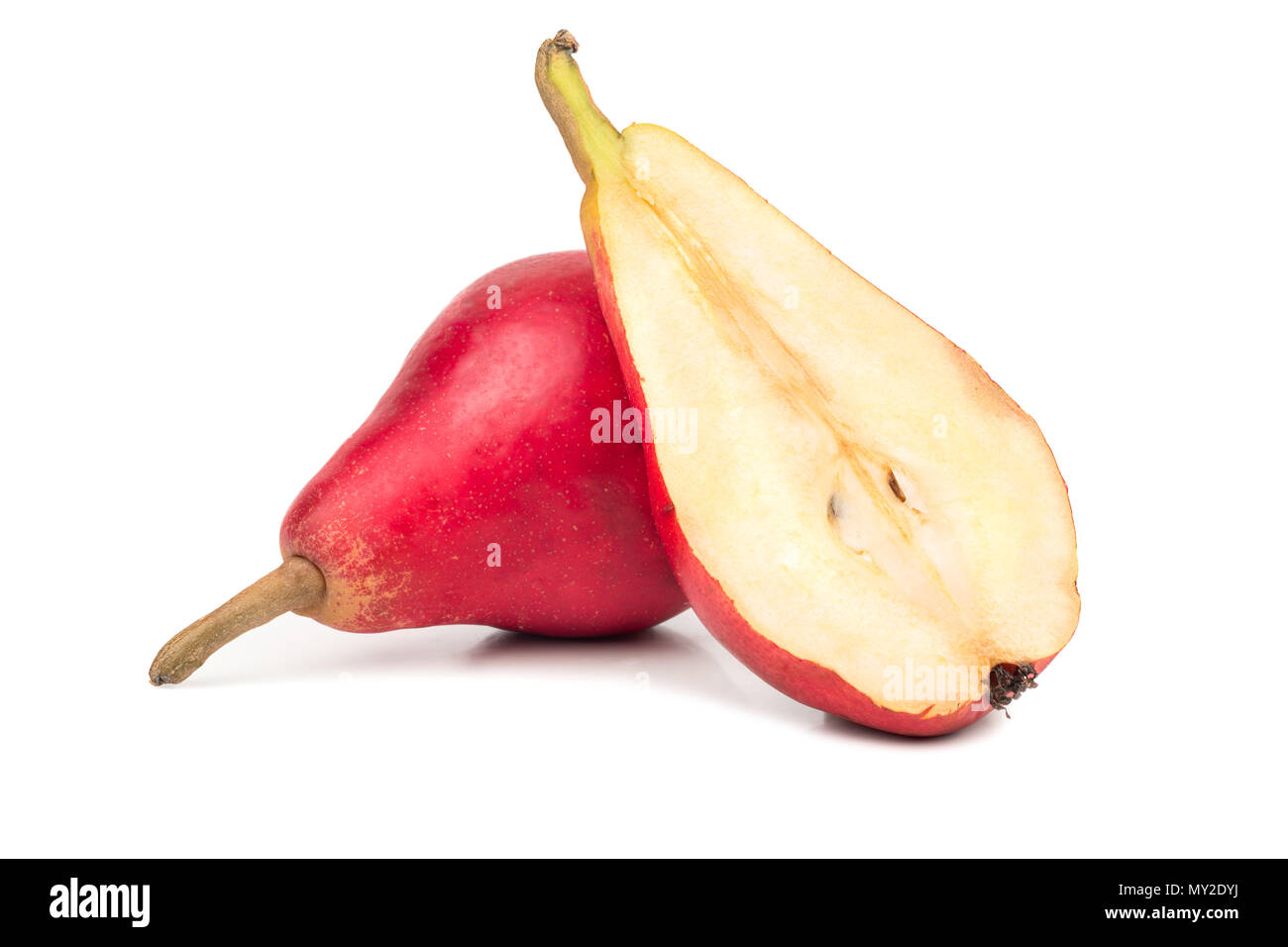 Fruit red pear with half on white background Stock Photo - Alamy
