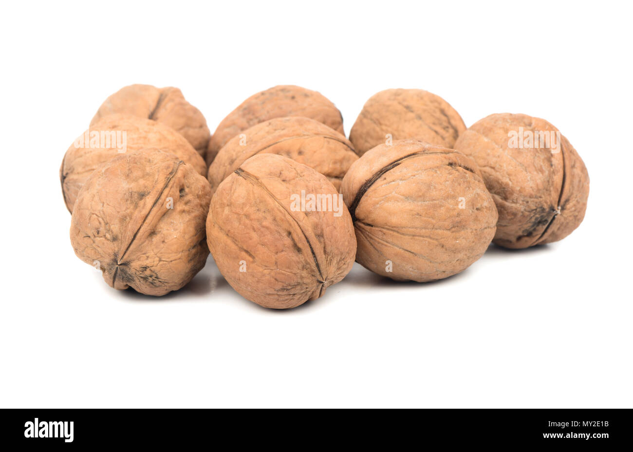 Bunch of walnuts in shell on white background Stock Photo - Alamy