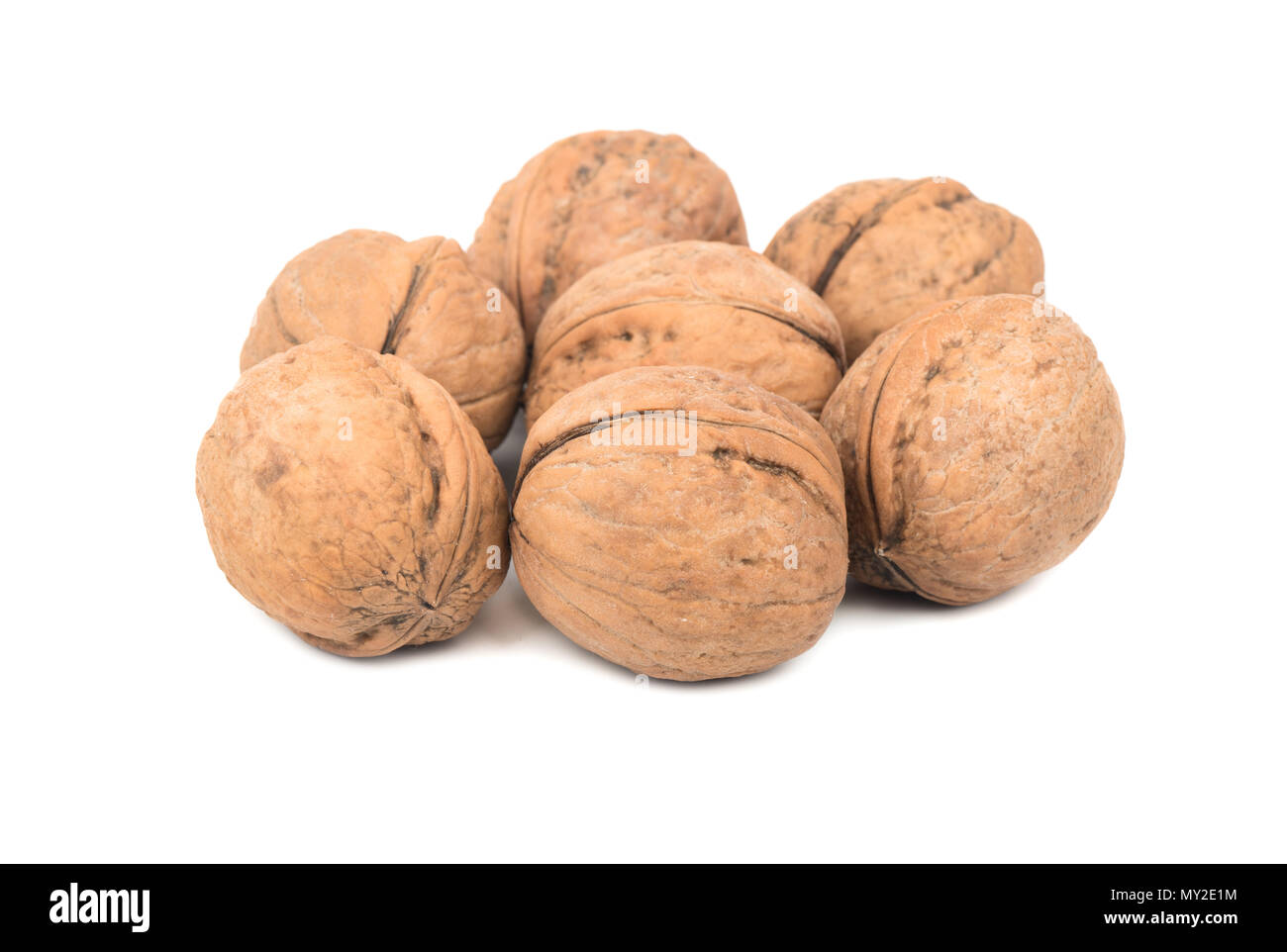 Bunch of walnuts in shell on white background Stock Photo - Alamy