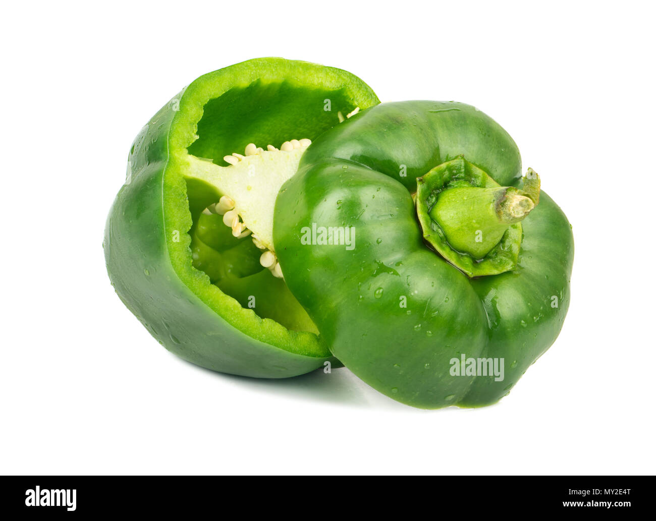 Fresh green bell pepper cut in half on white background Stock Photo - Alamy